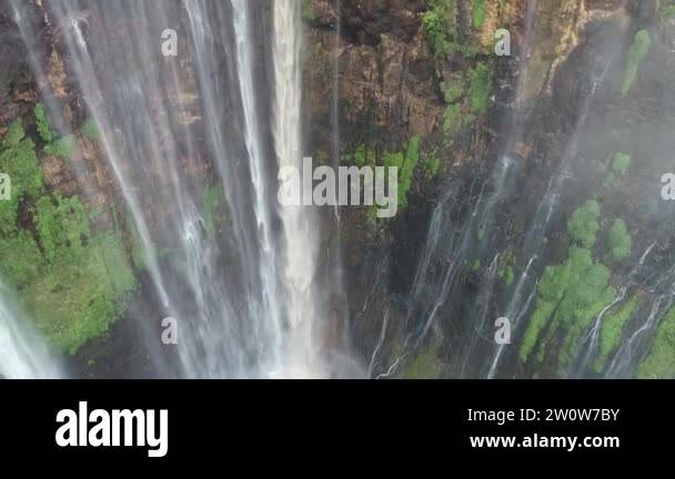 The nature of Indonesia. The island of Java. Waterfall Coban Sewu ...