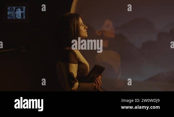 Astronaut looking out window of Mars base Stock Video Footage - Alamy