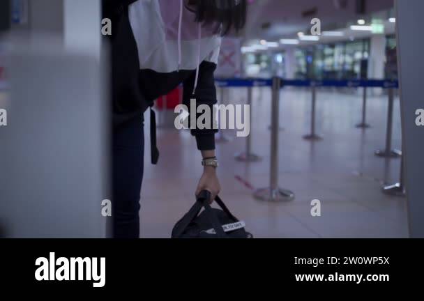 Asian woman passenger check her baggage at check in counter, asian ...