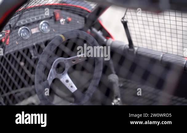 Steering wheel and dashboard in the cockpit of a sports buggy Stock ...