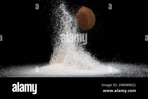 Coconut, cocos nucifera, Fruit and Powder Exploding against Black ...