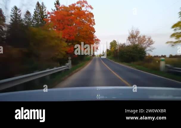 Rear View From Back of Car Driving Rural Countryside Road During Autumn ...