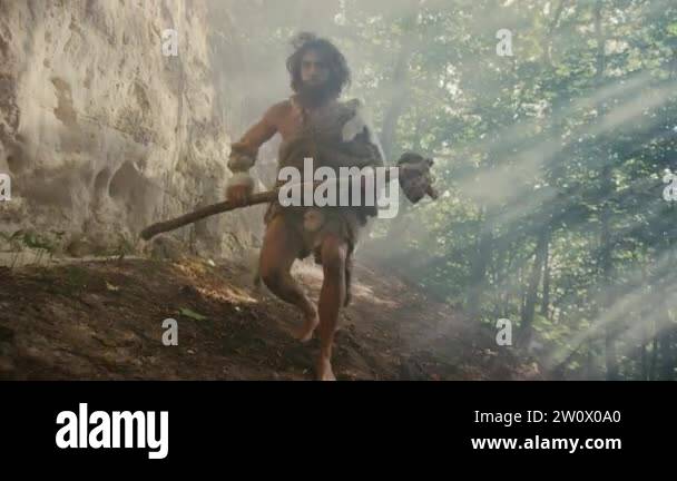Primeval Caveman Wearing Animal Skin Holds Stone Tipped Hammer Looks ...