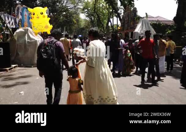 Father with balloon pikachu walk with daughter during Thaipusam Stock ...