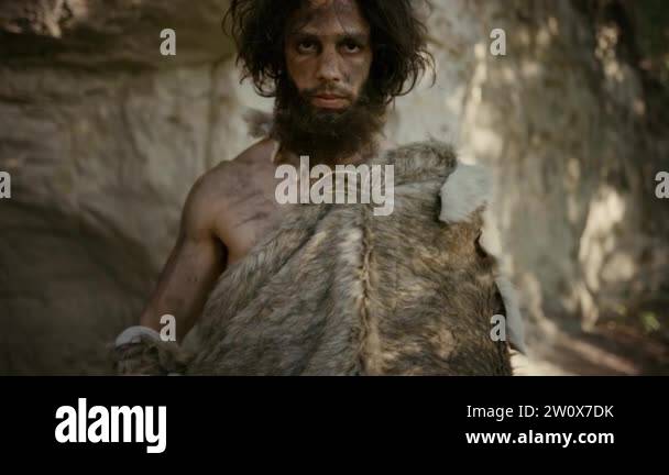 Portrait of Primeval Caveman Wearing Animal Skin Holding Stone Tipped ...