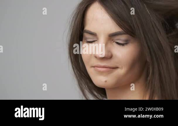 Portrait of a smiling pretty 25 year old woman with beautiful green ...