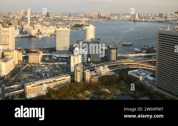 Aerial view Time lapse of Tokyo downtown overlooking Kyu Shiba Rikyu ...