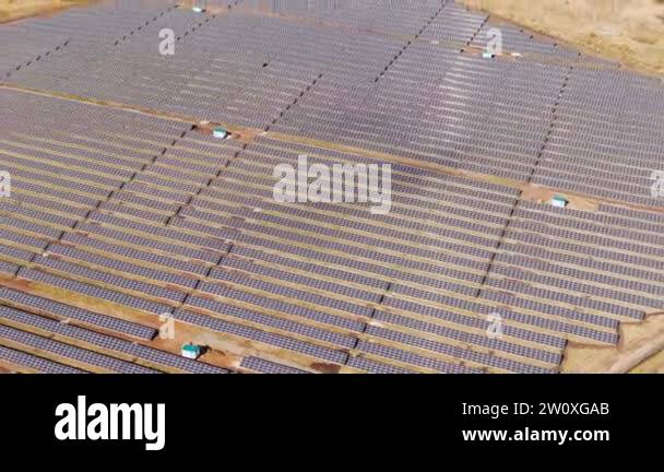 Dolly zoom aerial view of Solar Panels Farm (solar cell) with sunlight ...