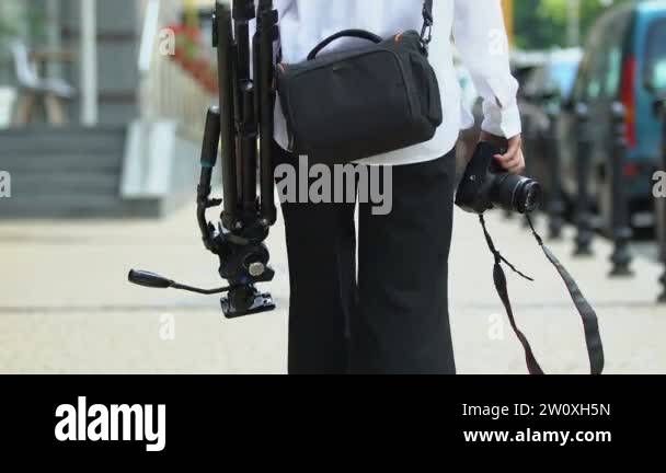Woman carrying tripod camera Stock Videos & Footage - HD and 4K Video ...