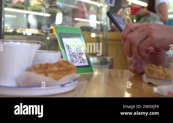Smartphone Scanning The Recipients Qr Code Mobile Banking Customers Can Pay Through Qr Code