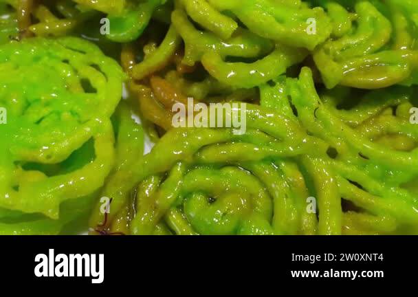 Crispy sweet Asian dessert green Jalebi cooked and served in Festival ...