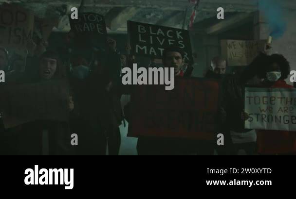 People chanting slogans and holding banners while protesting against ...
