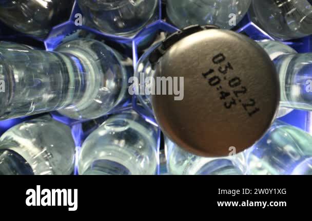 View Of Clear Glass Bottles Filled With Water And Metal Caps With ...
