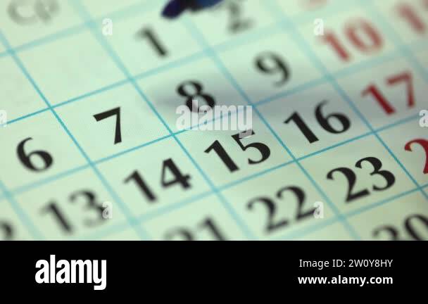 7th seventh day of the month. The woman marks the calendar date with a ...