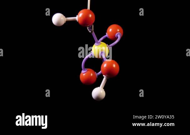 Chemical Formula of a molecule rotating isolated on a black background ...