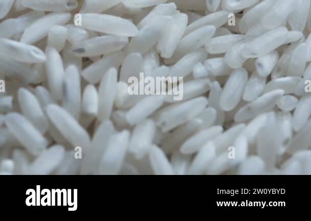 Grocery video background white polished rice close-up rotates in front ...