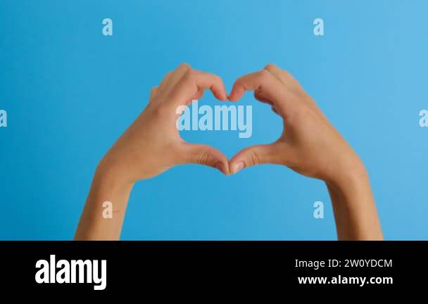 Hands In Shape Of Heart Symbolizing Love Peace And Unity Woman