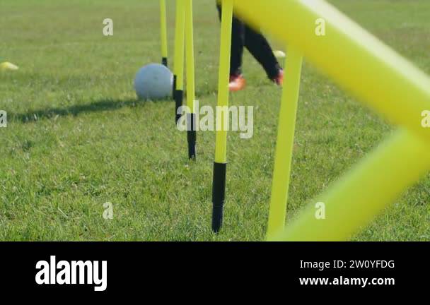Soccer agility training equipment. Football player legs dribbling ball ...