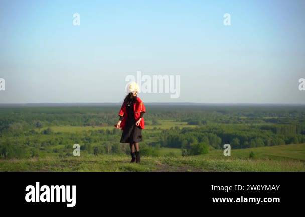 Georgian girl in white papakha and red national dress dances national ...