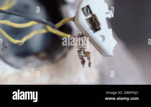 Electricity and high voltage twisted wires in socket, insulated ...