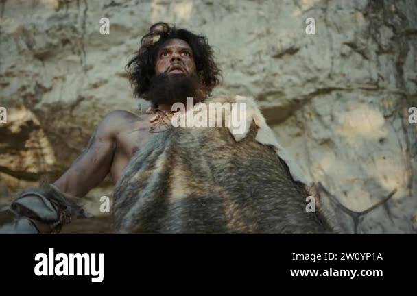 Portrait of Primeval Caveman Wearing Animal Skin Does Threatening Chest ...