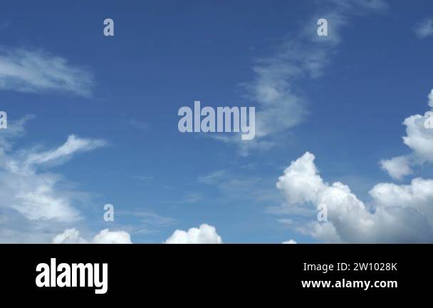 Beautiful blue sky with clouds background. Beautiful cloud flying in blue sky. Rolling puffy ...