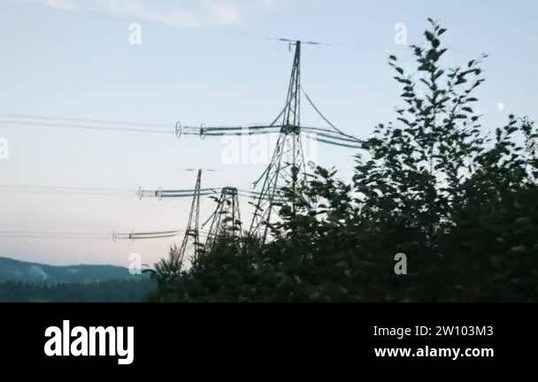 Transmission towers in mountains. Power towers against sunset sky ...