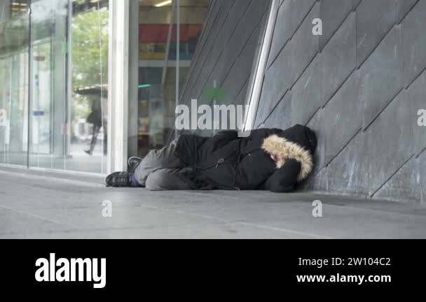 Homeless man sleeping entrance Stock Videos & Footage - HD and 4K Video ...