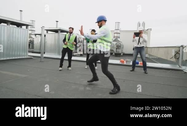 An architecture fine man with glasses and a beard modern dances in ...