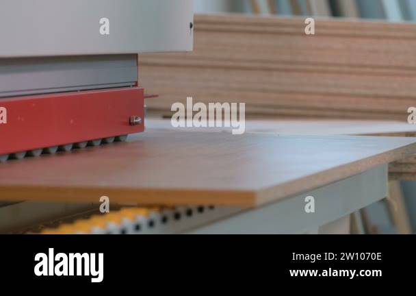 Machine for edging wooden parts. Furniture manufacturing workshop. The ...