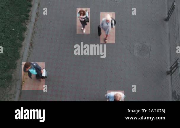 High view camera of people walking. Facial recognition interface scans ...