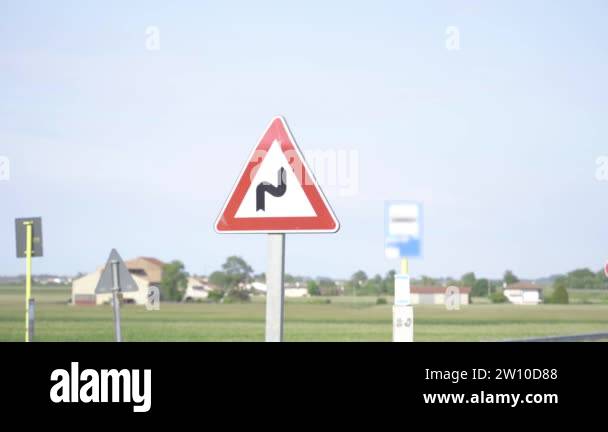 Dangerous turn traffic sign Stock Videos & Footage - HD and 4K Video ...