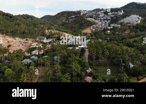 Tropical terrain covered with endangered forests and luxury villas ...