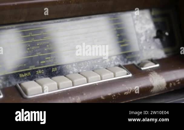 Close up of an old radio receiver with rubbing and white buttons, retro ...