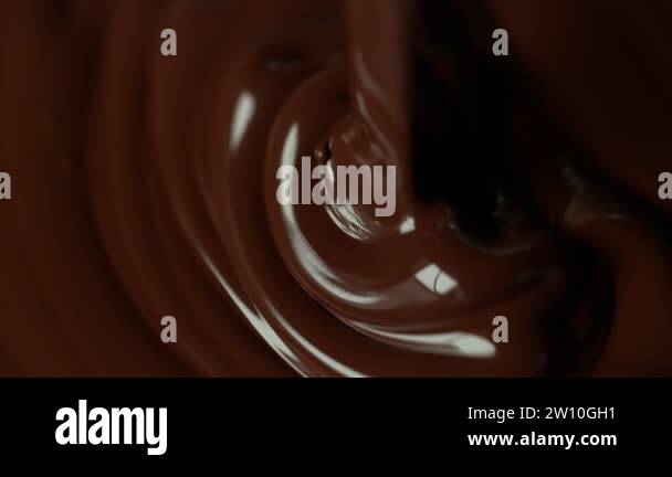 Super slow motion of pouring dark hot chocolate. Filmed with cinema high speed camera, 1000fps ...