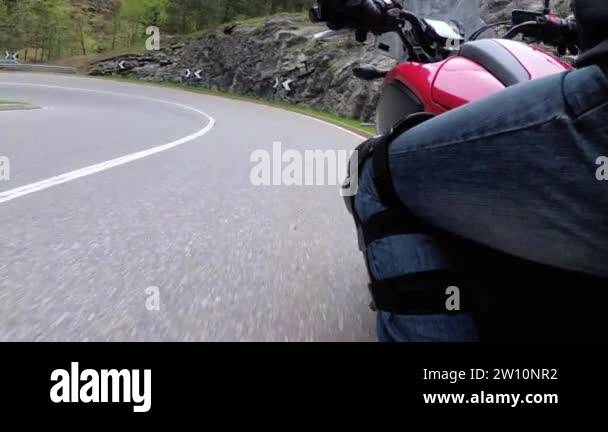 Motorcyclist Rides along on the Scenic Mountain Curve Road. Side view ...