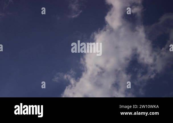 PUFFY CLOUDS, Puffy fluffy white clouds blue sky time lapse motion background. Bright blue sky ...