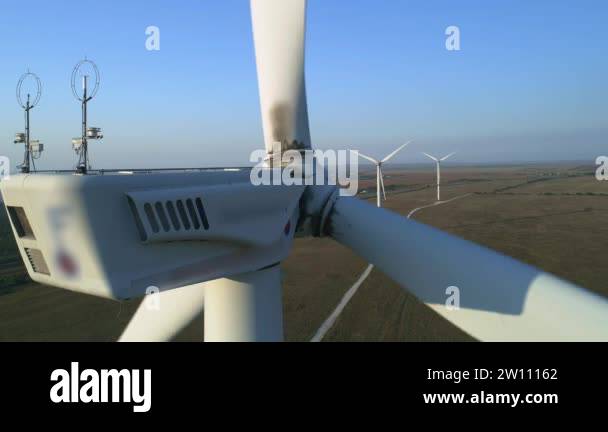Close up of a wind turbine. Aerial top view wind turbine, moving above ...