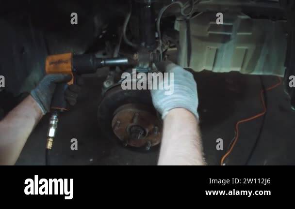 Photo of repair of a running gear of the car mechanic's hands Stock ...