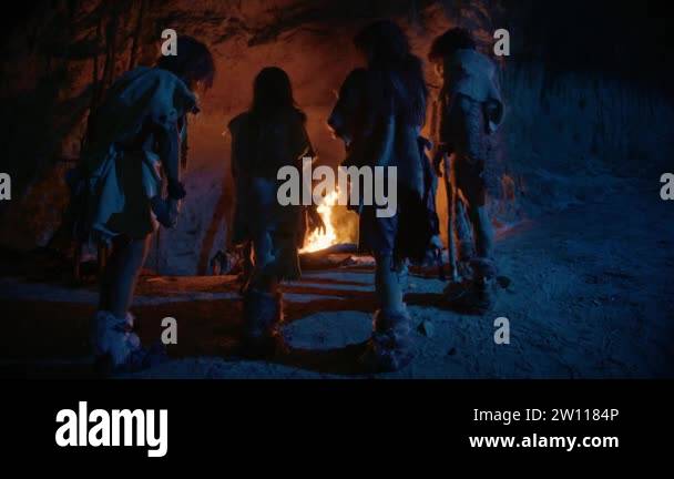 Tribe of Prehistoric Hunter-Gatherers Wearing Animal Skins Live in a ...