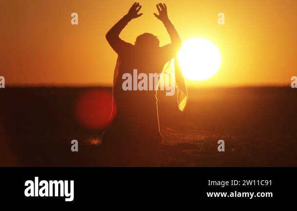 Islamic warrior with Kalashnikov at sunset day. Muslim fighter is ...