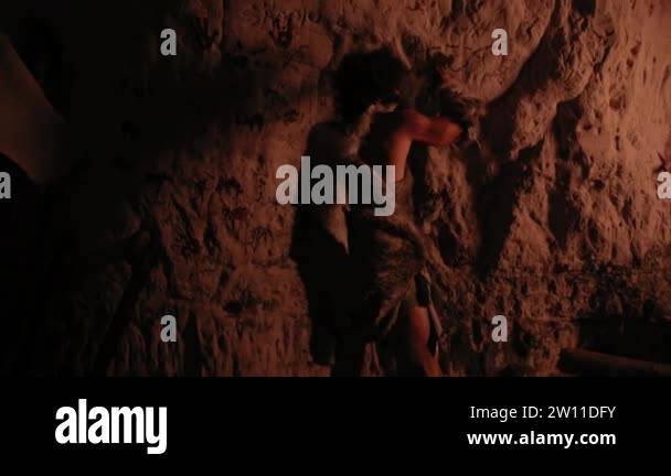 Primitive Prehistoric Neanderthal Wearing Animal Skin Draws Animals and ...
