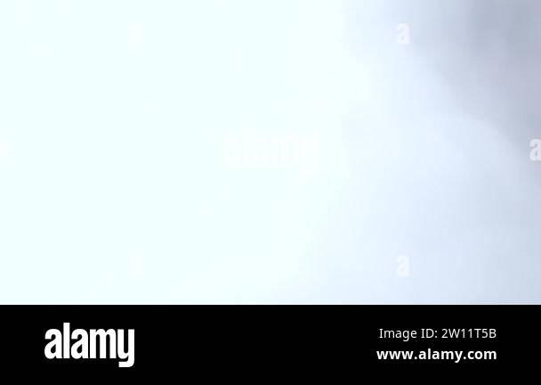 White smoke floating through space against black background. Mist ...