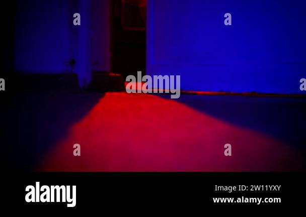 Red light flickers in an empty room. Crime scene. Fear of loneliness ...
