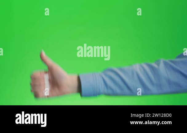 Thumbs up sign hand gesture on green screen. Simbol of approval like ...