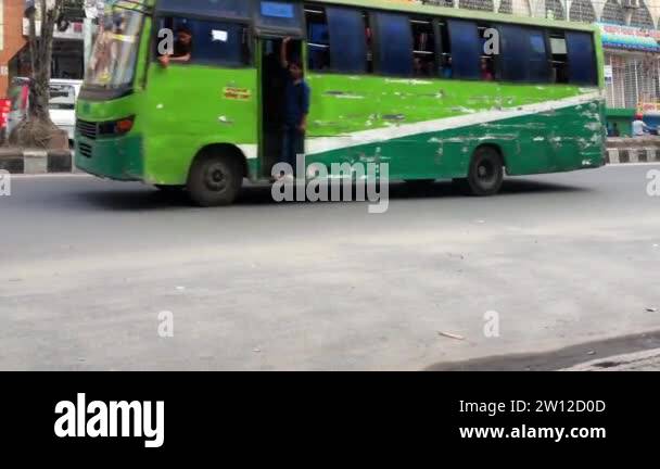Unidentified people and street traffic at the Ring Road in the Adabor ...