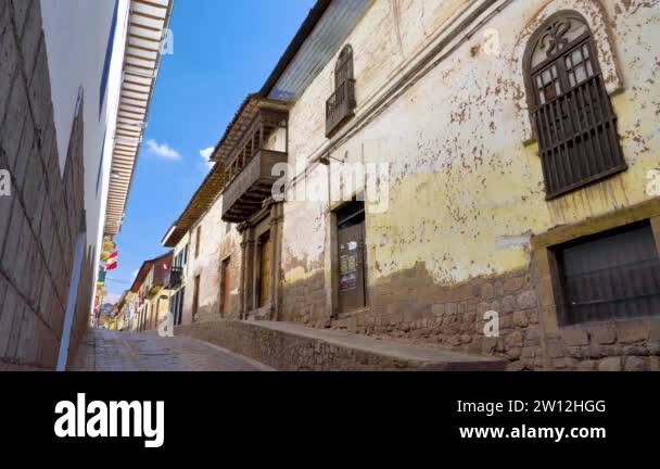 Streets of Cusco. Old houses in white color combines old inca walls ...