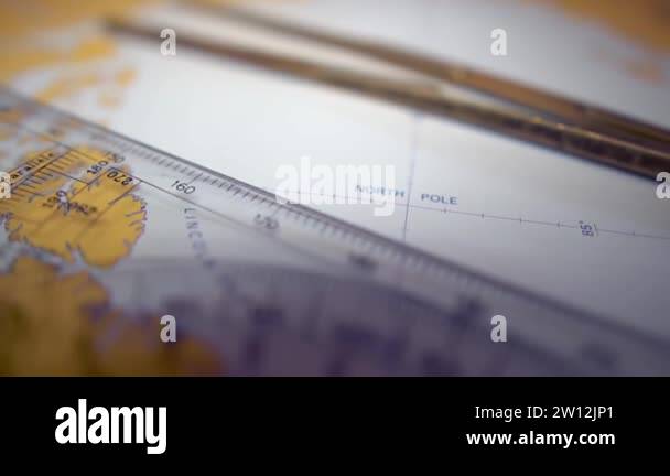 Plotting position on navigational chart at sea. Marine Map and ruler ...