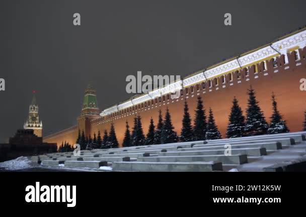Kremlin wall. The famous clock tower and red star on top. Mausoleum of ...