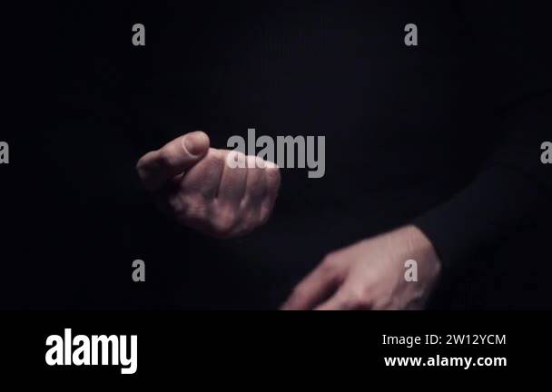 A man makes an obscene gesture showing the middle finger, close-up on a ...